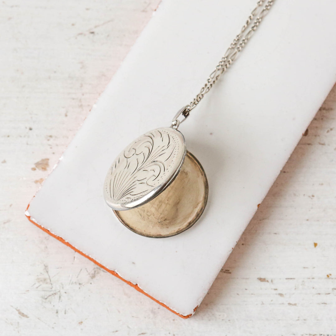 Large round silver locket store